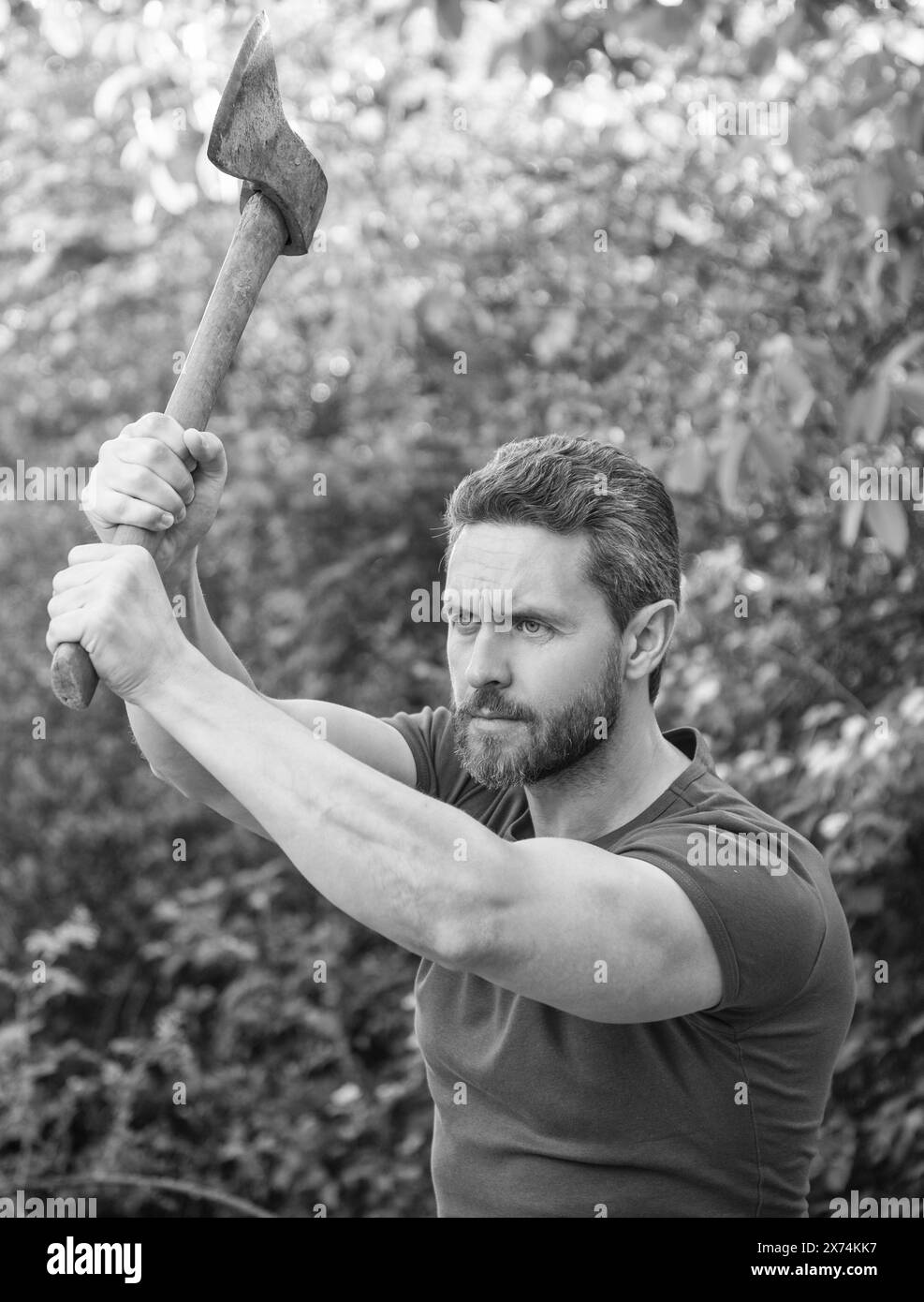 caucasian man hit with axe outdoor. photo of man hit with axe. man hit ...