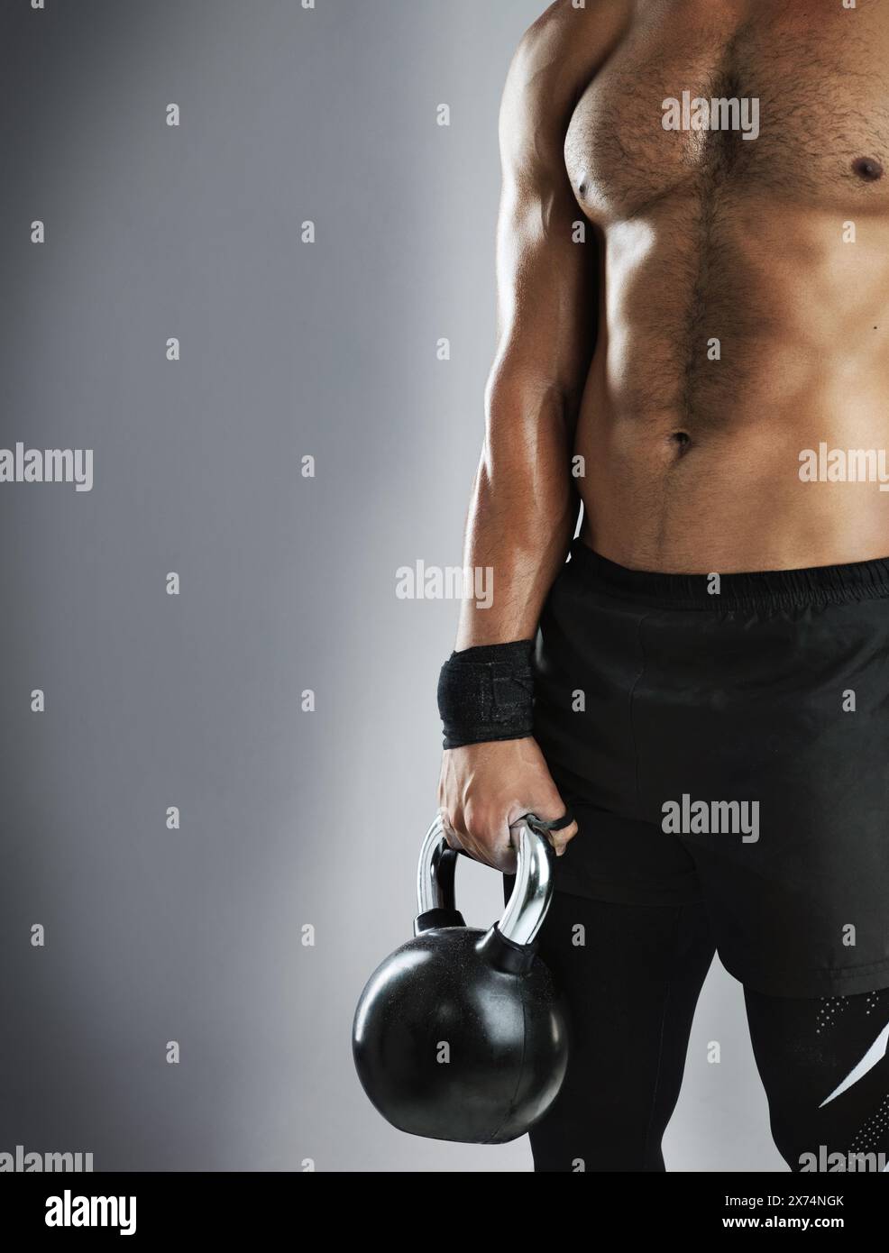 Hand, man and kettlebell as bodybuilding in studio for fitness workout ...