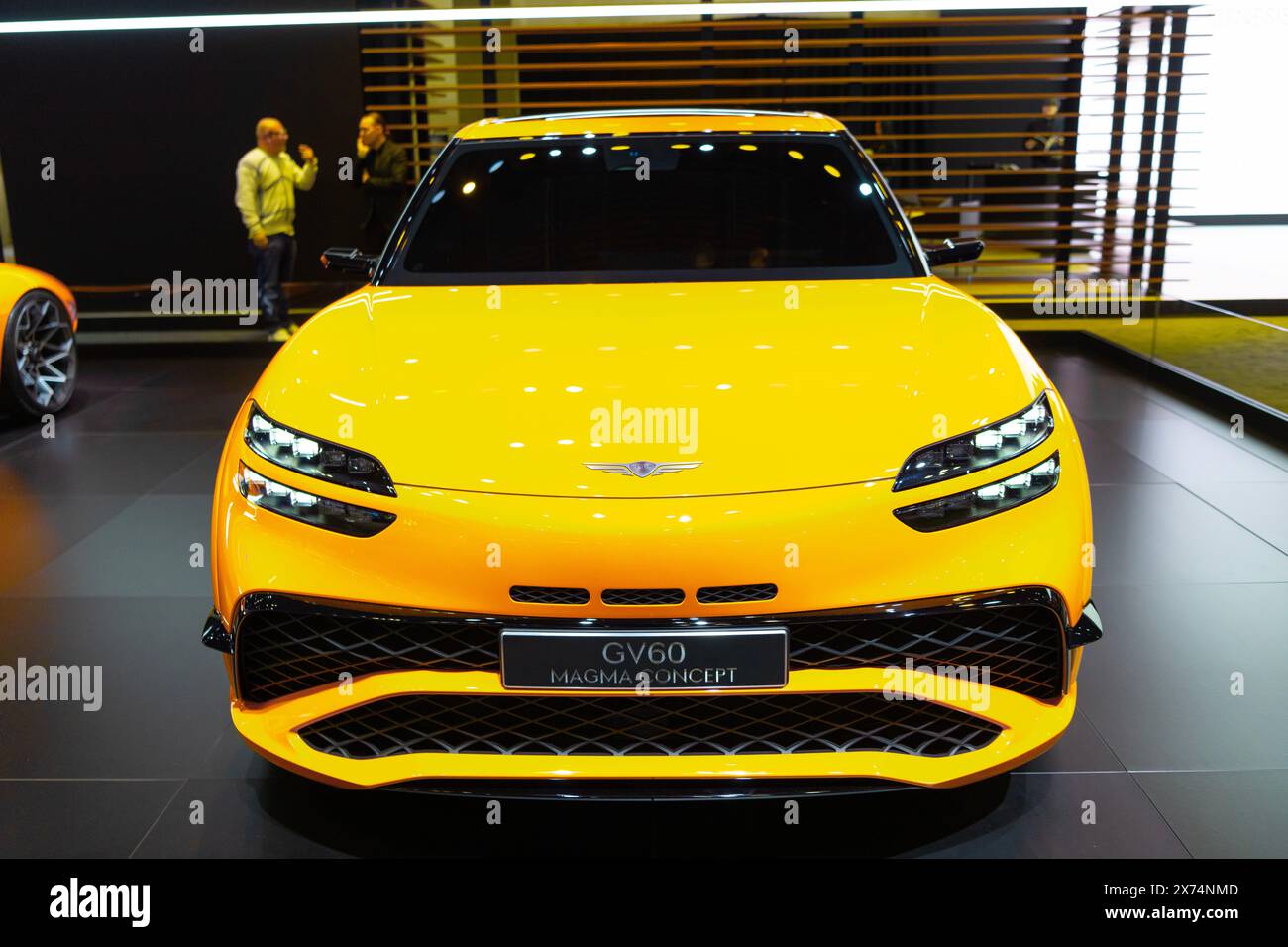 New York City, USA - March 27, 2024: Genesis GV60 Magma electric yellow ...