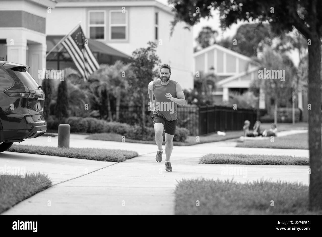 sport fit man jogging outdoor. The running man races down the ...