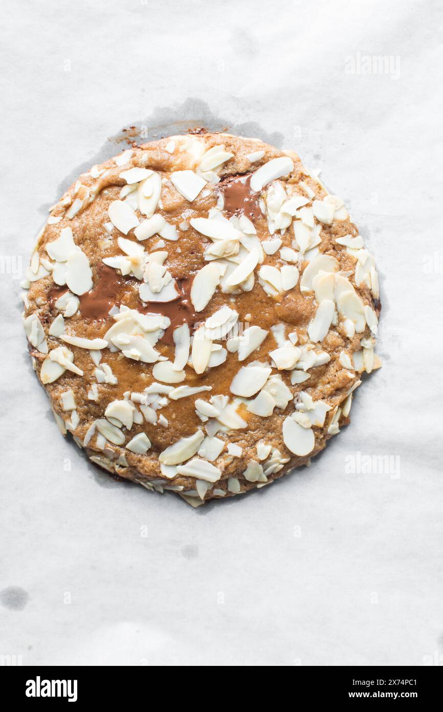 Overhead view of almond chocolate chip cookies, sliced almond coated ...