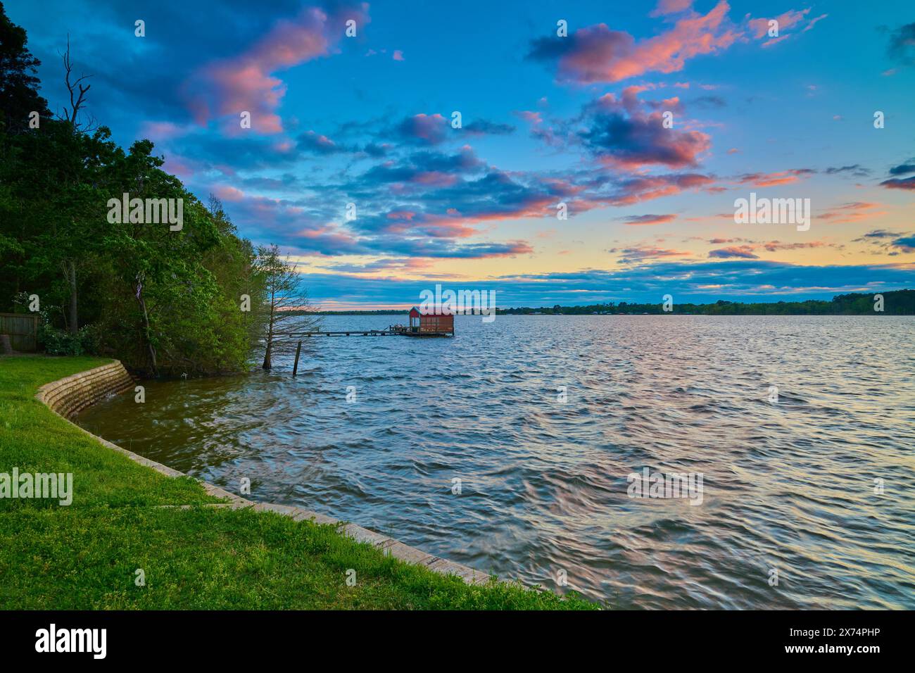 Boathouse on Lake Tyler, Texas with colorful clouds Stock Photo - Alamy