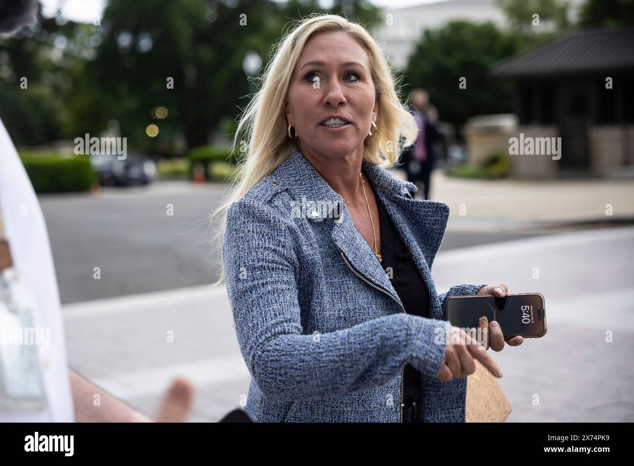 Rep. Marjorie Taylor Greene (R-Ga.) speaks with reporters as she ...