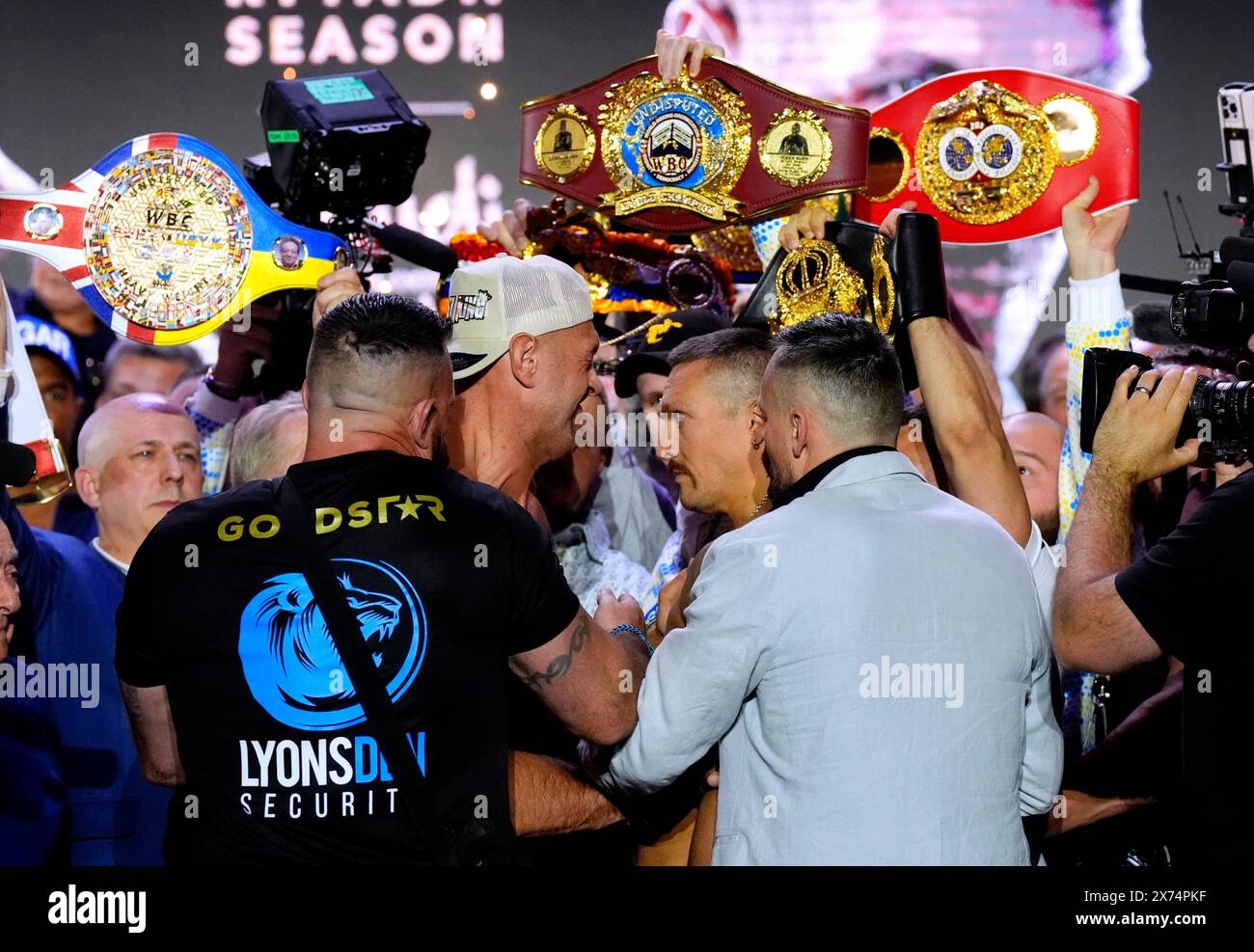 Tyson Fury and Oleksandr Usyk face off during a weigh-in at BLVD City ...