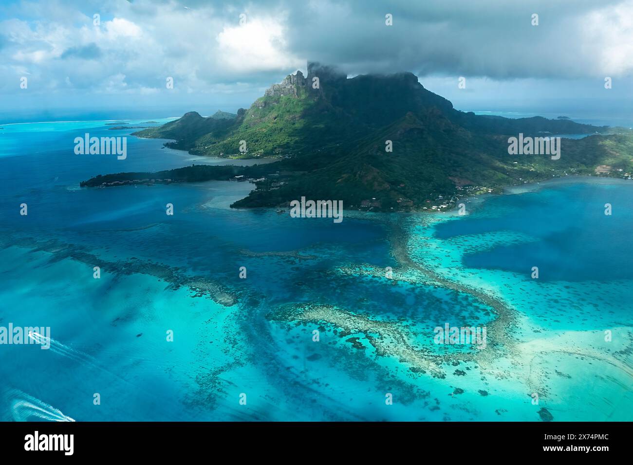 Aerial view of the coral reef and its turquoise water, Bora Bora ...