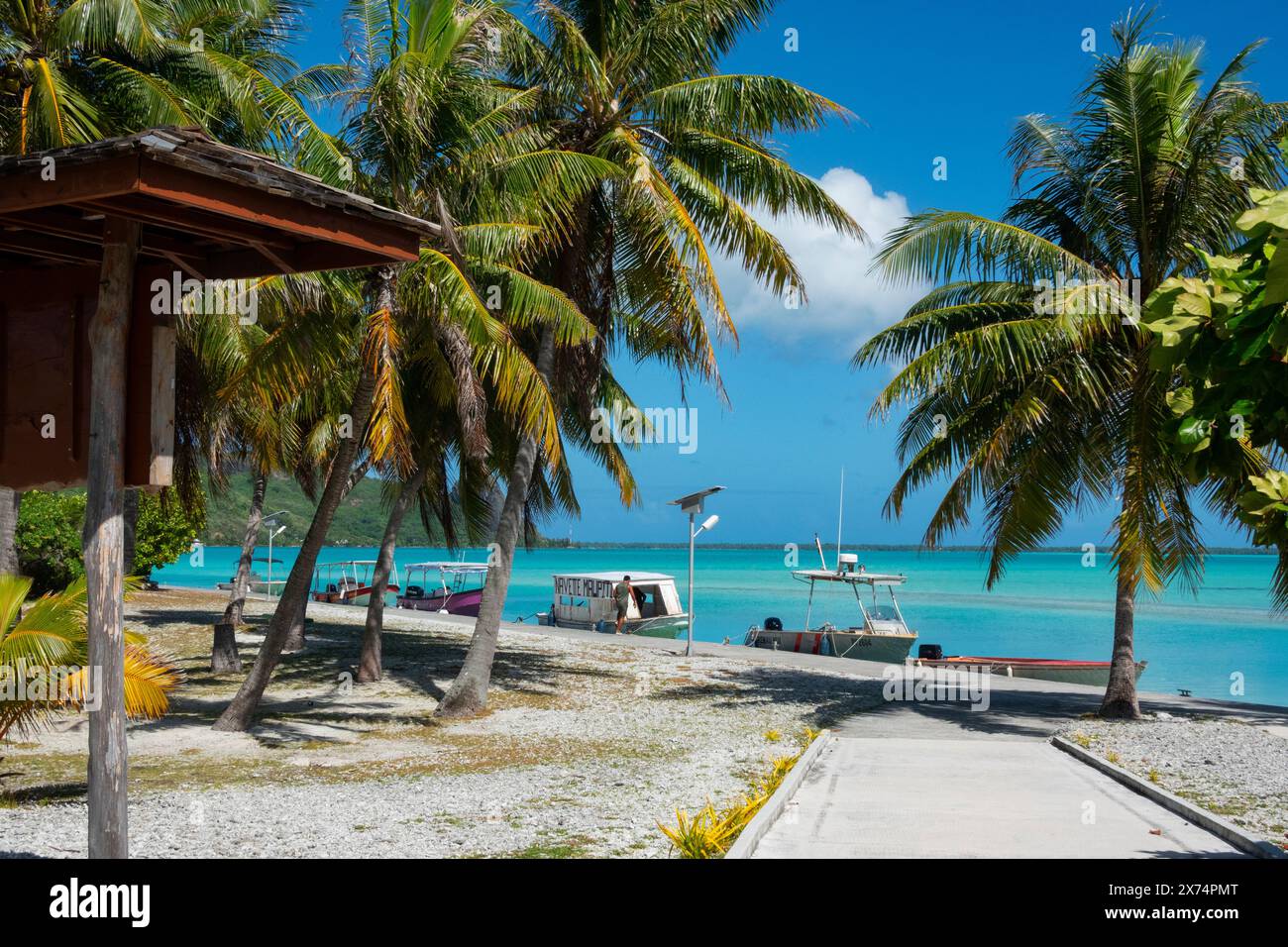 Shuttle boats at Maupiti airport waiting to transport people to the ...