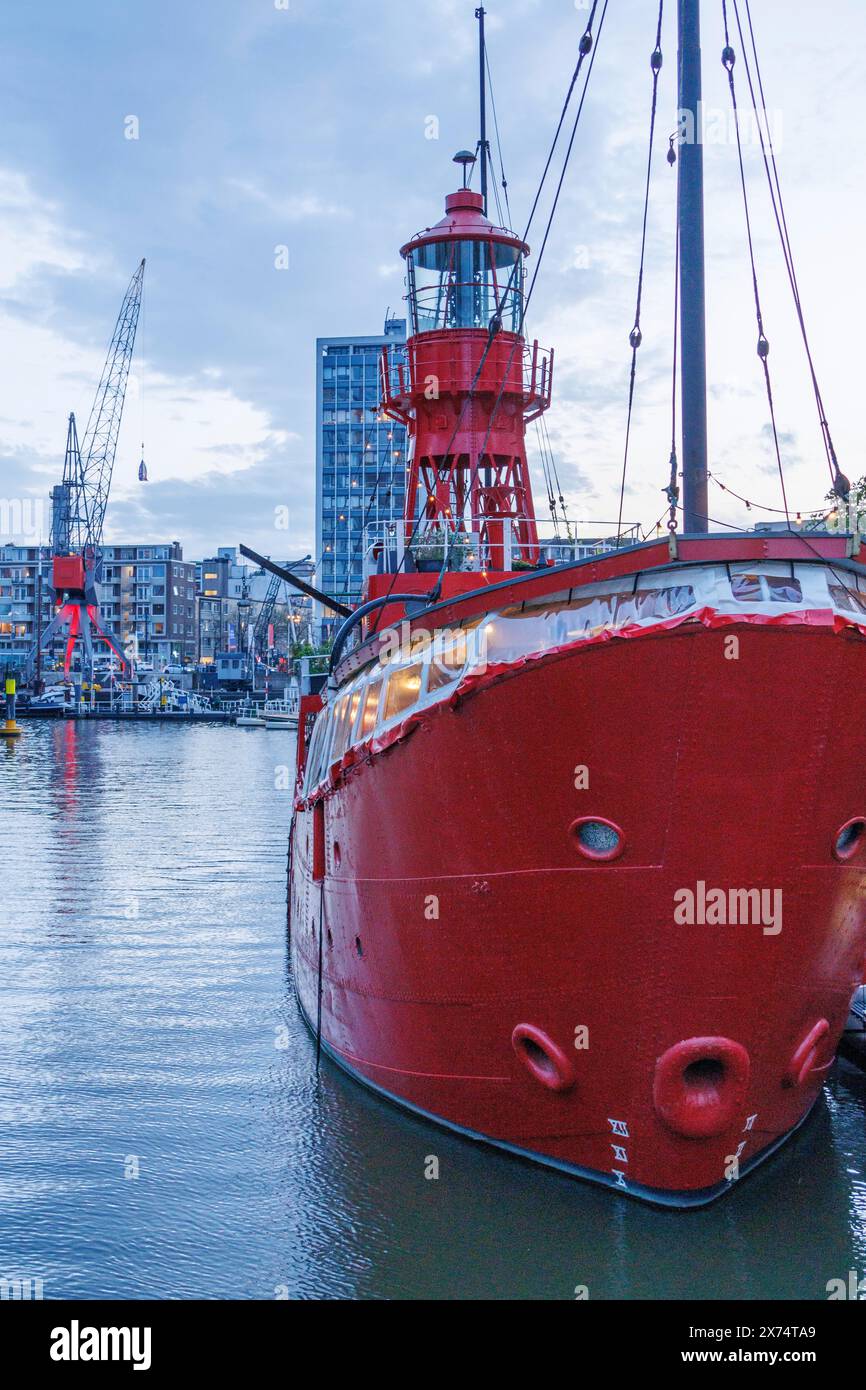 Big red ship in the harbour with cranes and skyscraper in the ...