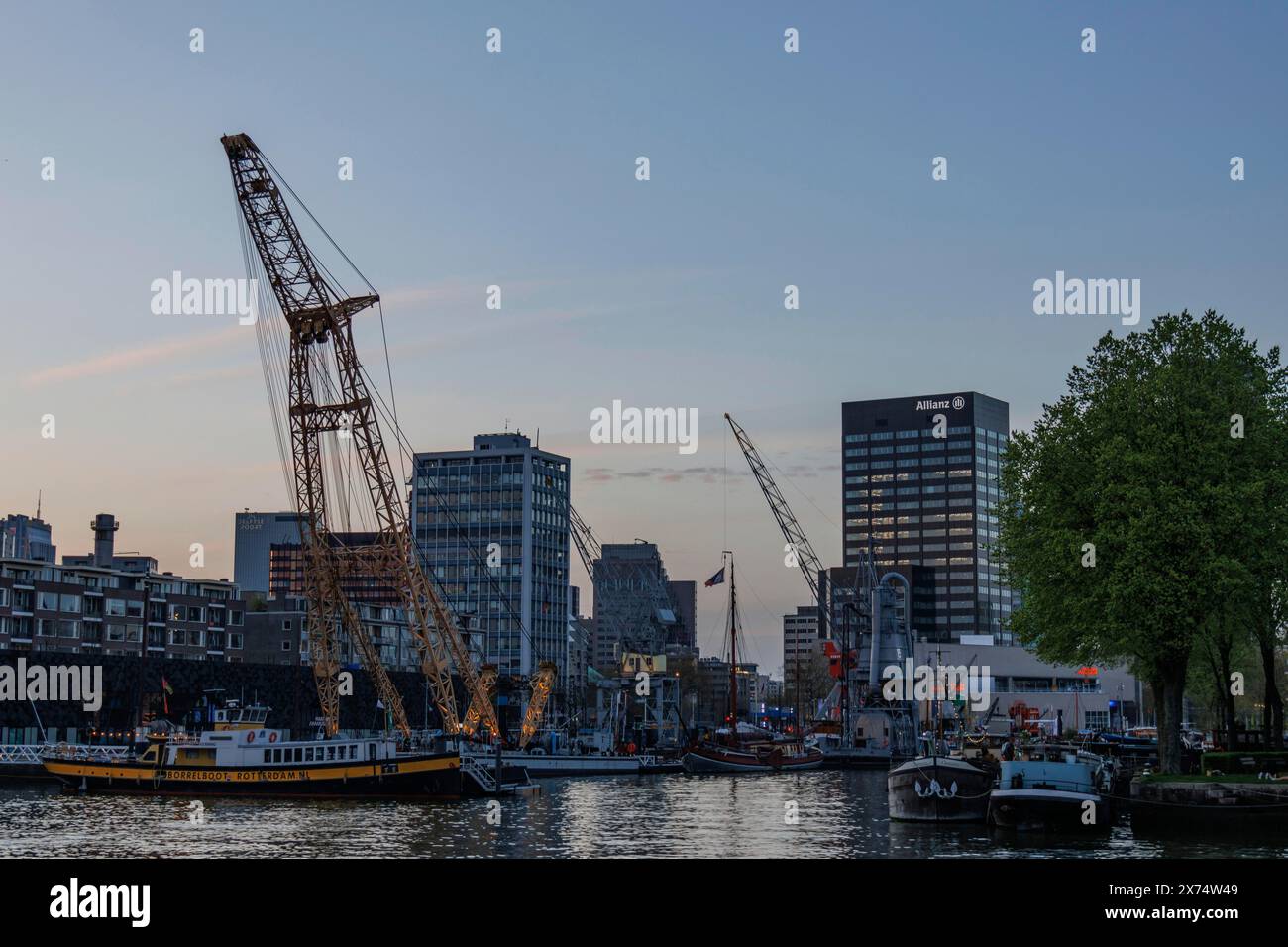 Harbour view with cranes, ships and skyscrapers in a slightly cloudy ...