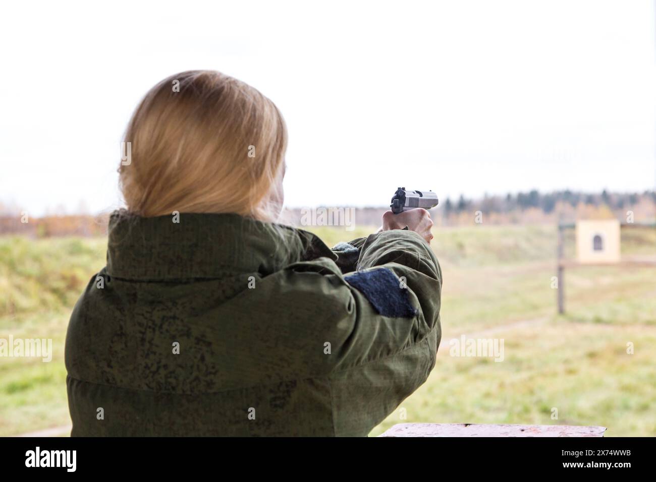 Man shooting at a target. Unformal shooting range Stock Photo - Alamy