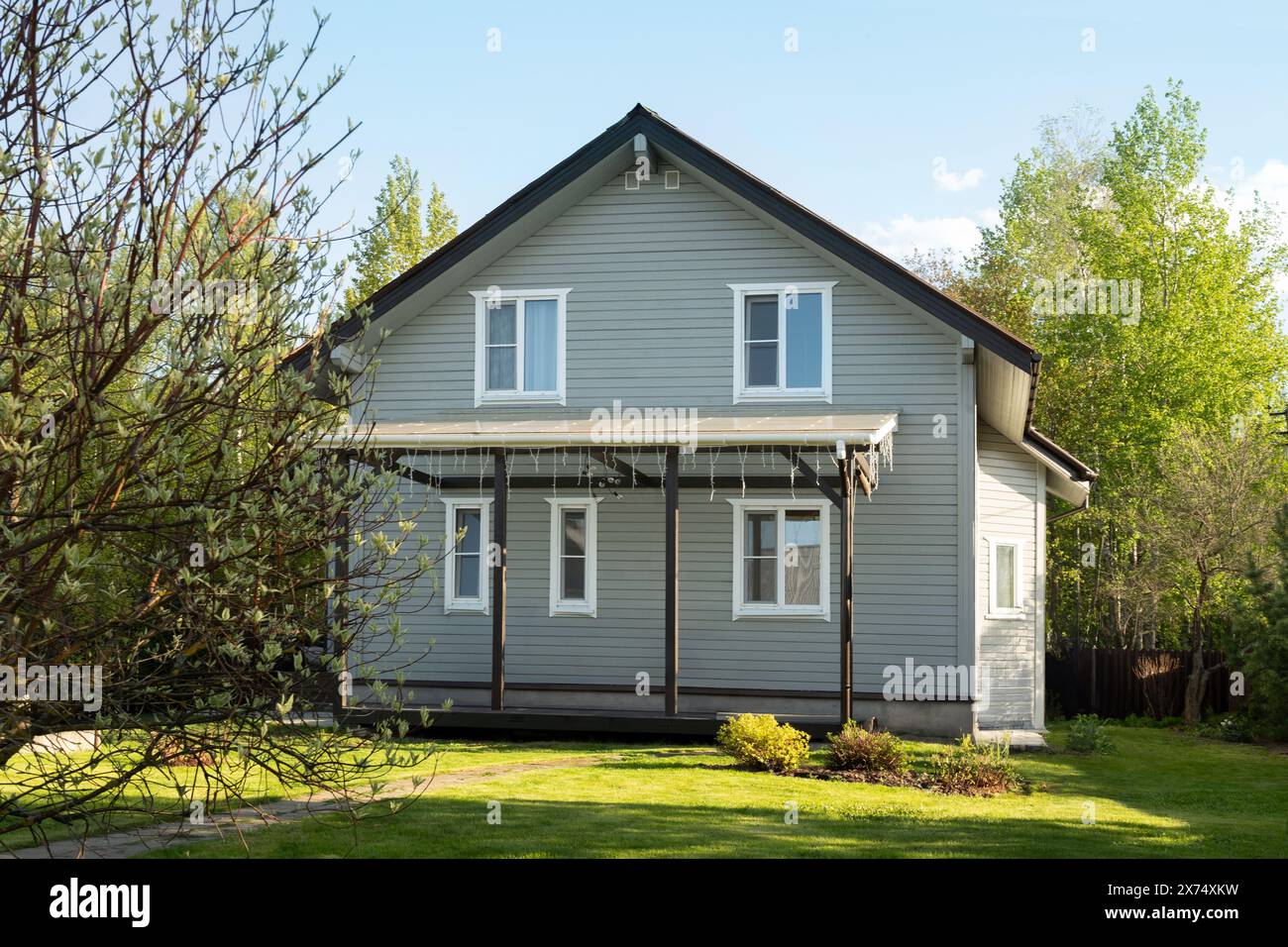 Cottagecore contemporary two-story house of timber in countryside in ...