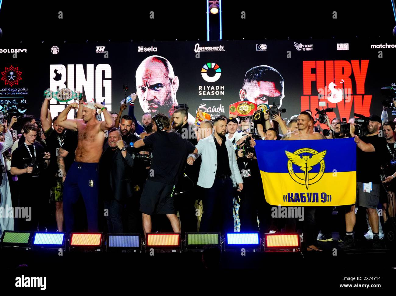 Tyson Fury and Oleksandr Usyk on stage during a weigh-in at BLVD City ...