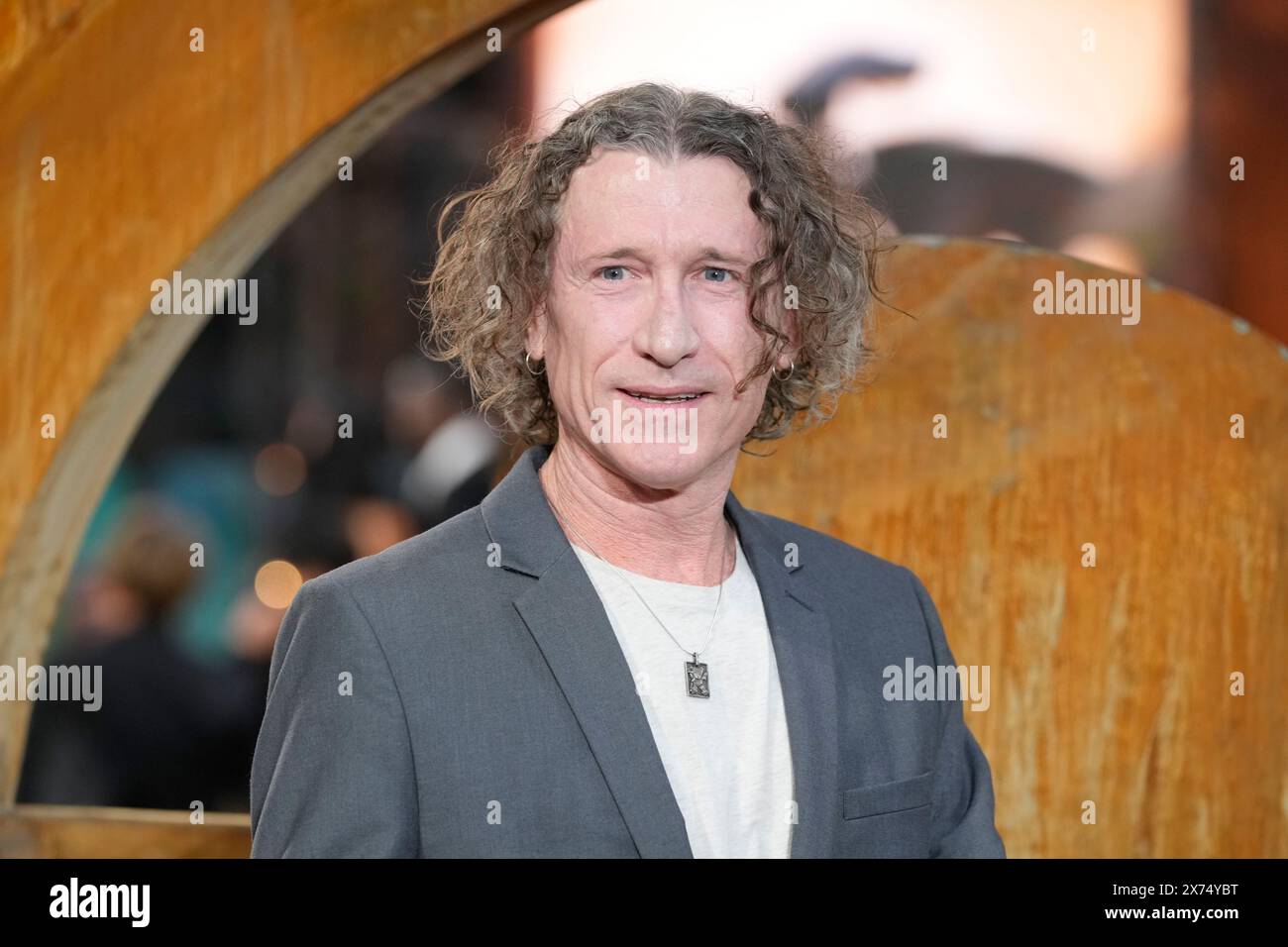 David Collins poses for photographers upon arrival at the UK Premiere ...