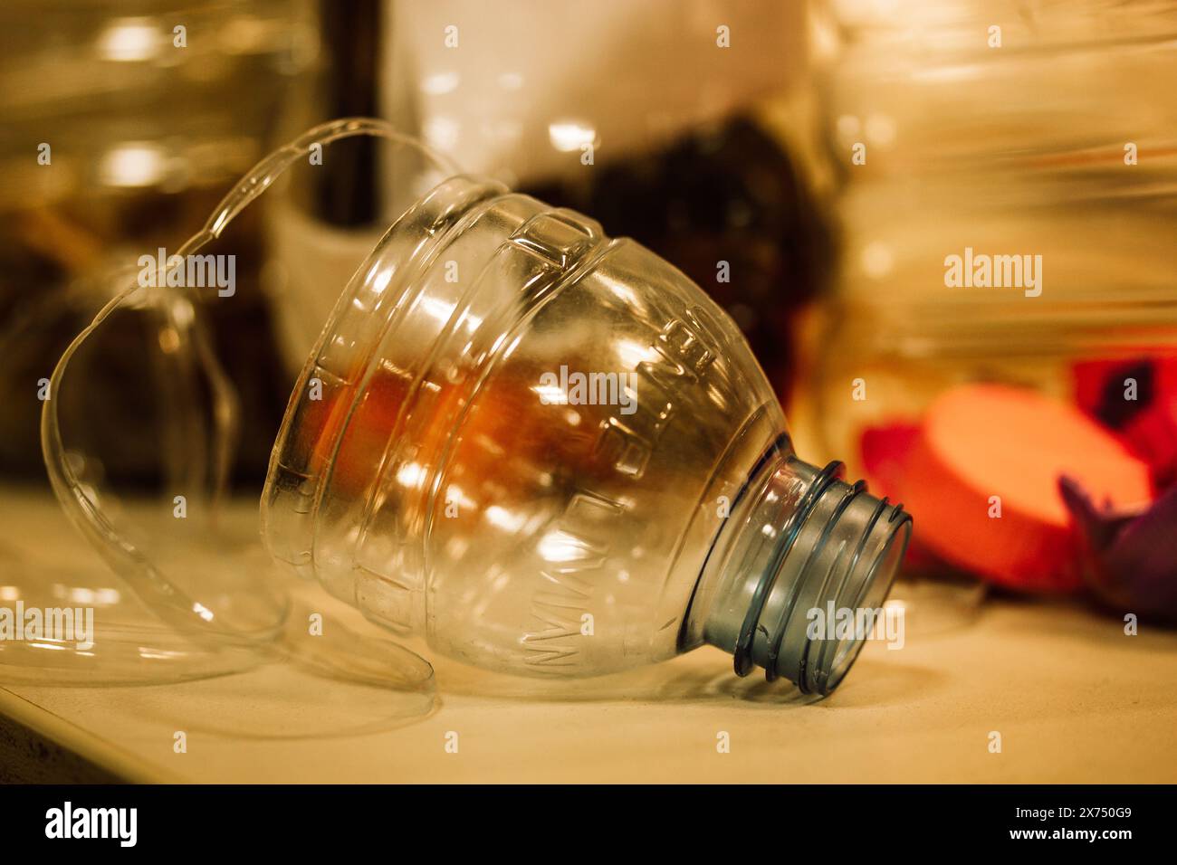 Recycling blue plastic bottle to be reused for manufacturing. New life ...