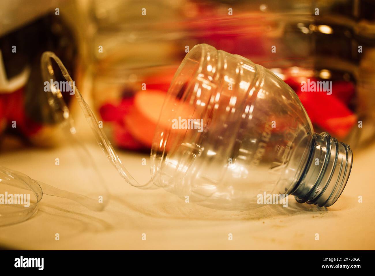 Recycling blue plastic bottle to be reused for manufacturing. New life ...