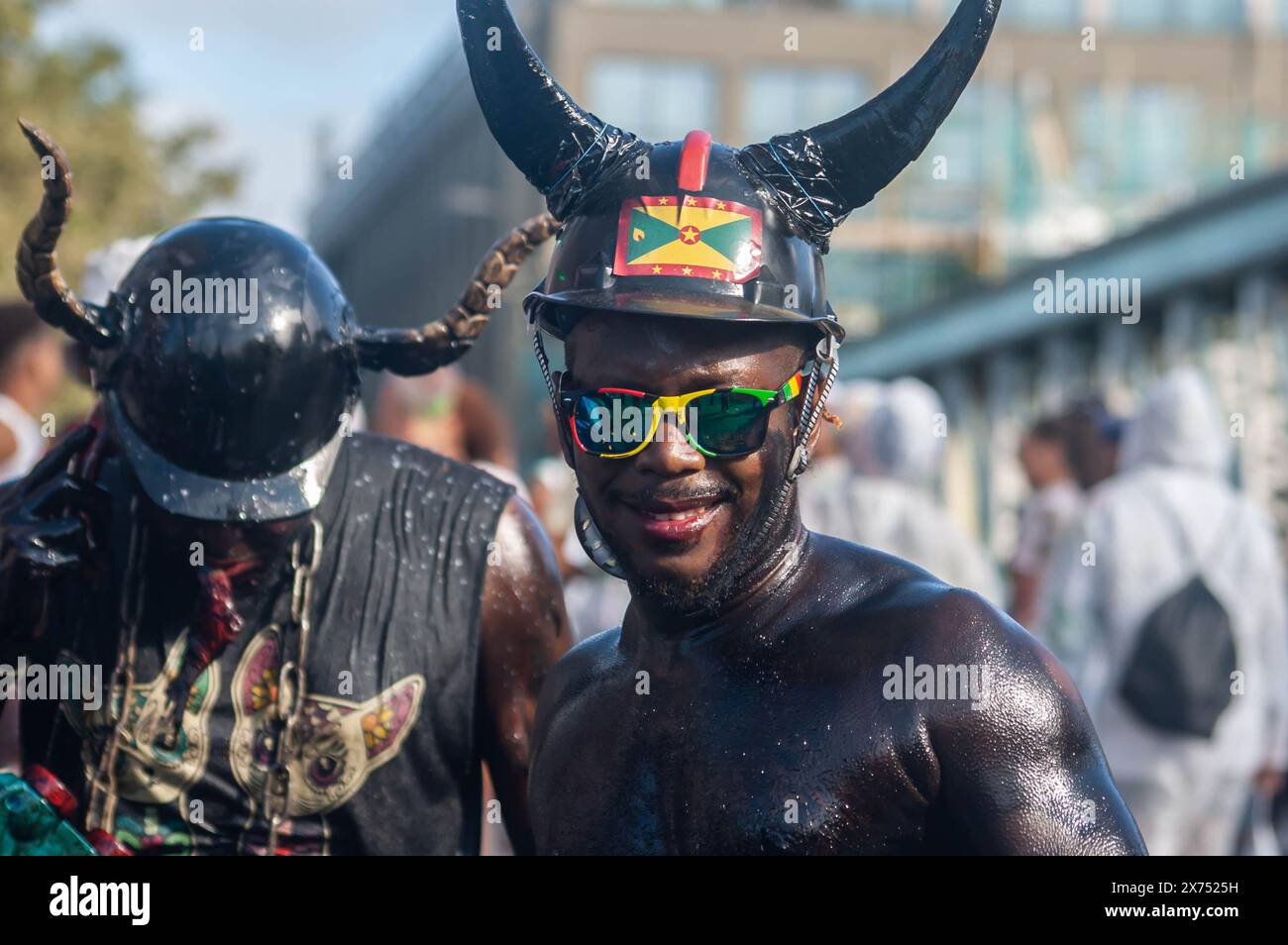 NOTTING HILL, LONDON, ENGLAND - 27 August 2023: Man covered in oil and ...