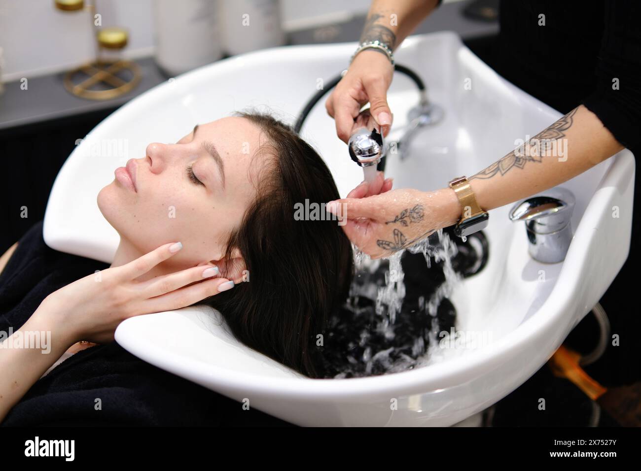 Tirana, Albania - 17 May 2024: Hair stylist working in a salon. High ...
