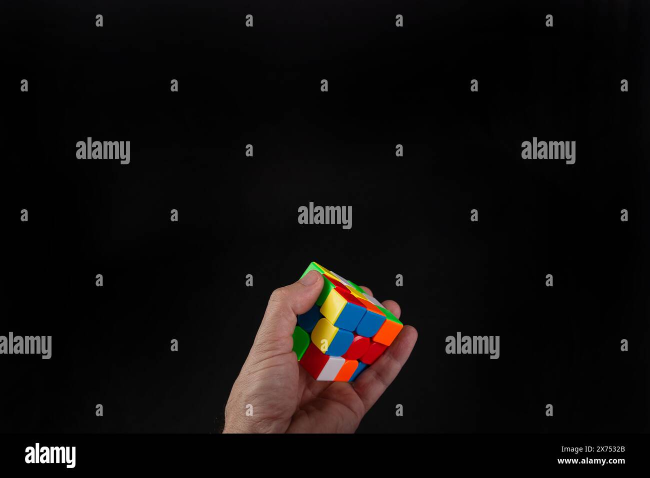 Salvador, Bahia, Brazil - May 15, 2024: Rubiks cube in a persons hands ...