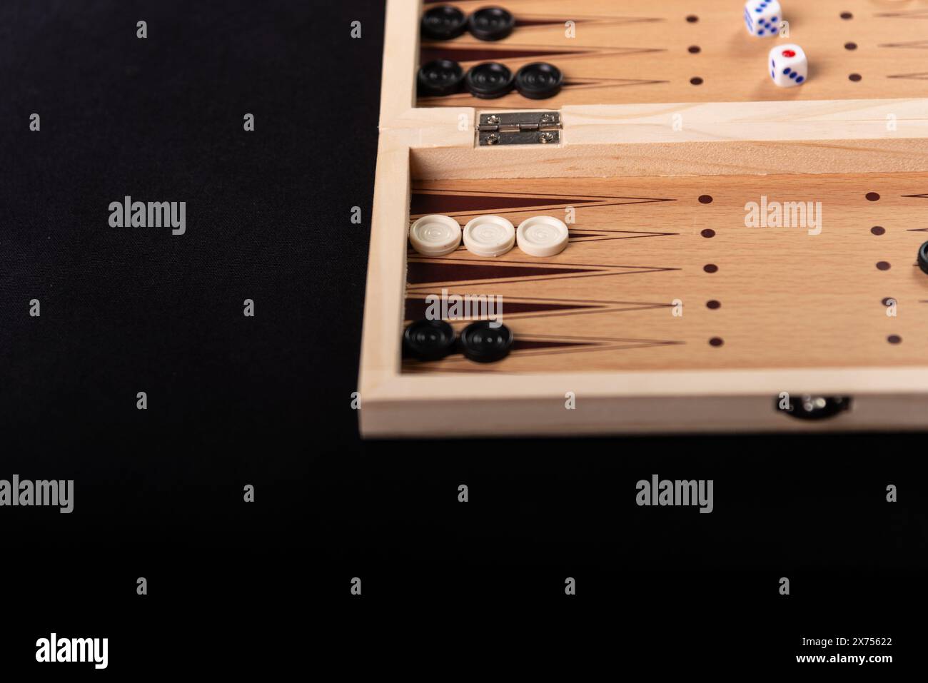 Traditional backgammon game. Board with backgammon game pieces on black ...