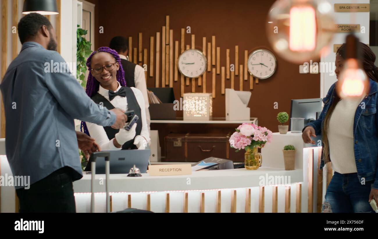 Guests leaving access key card at reception after amazing holiday ...