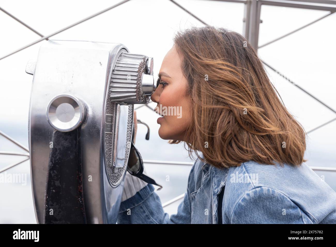 Chrissy Teigen visits Empire State Building in New York on May 17, 2024 ...