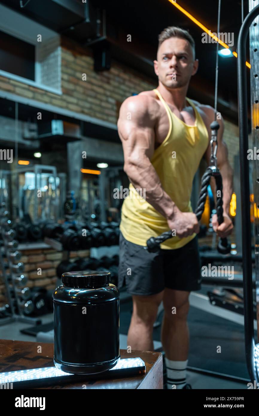 muscular bodybuilding athlete with perfect body exercising protein or ...