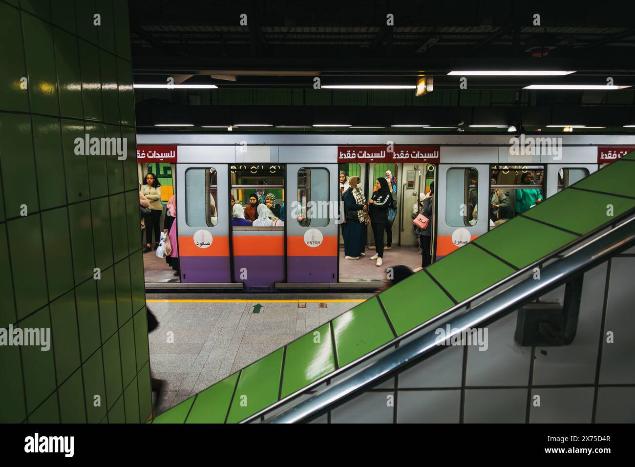 passengers onboard a train at the Mohamed Naguib station on the Cairo Metro, Egypt Stock Photo ...