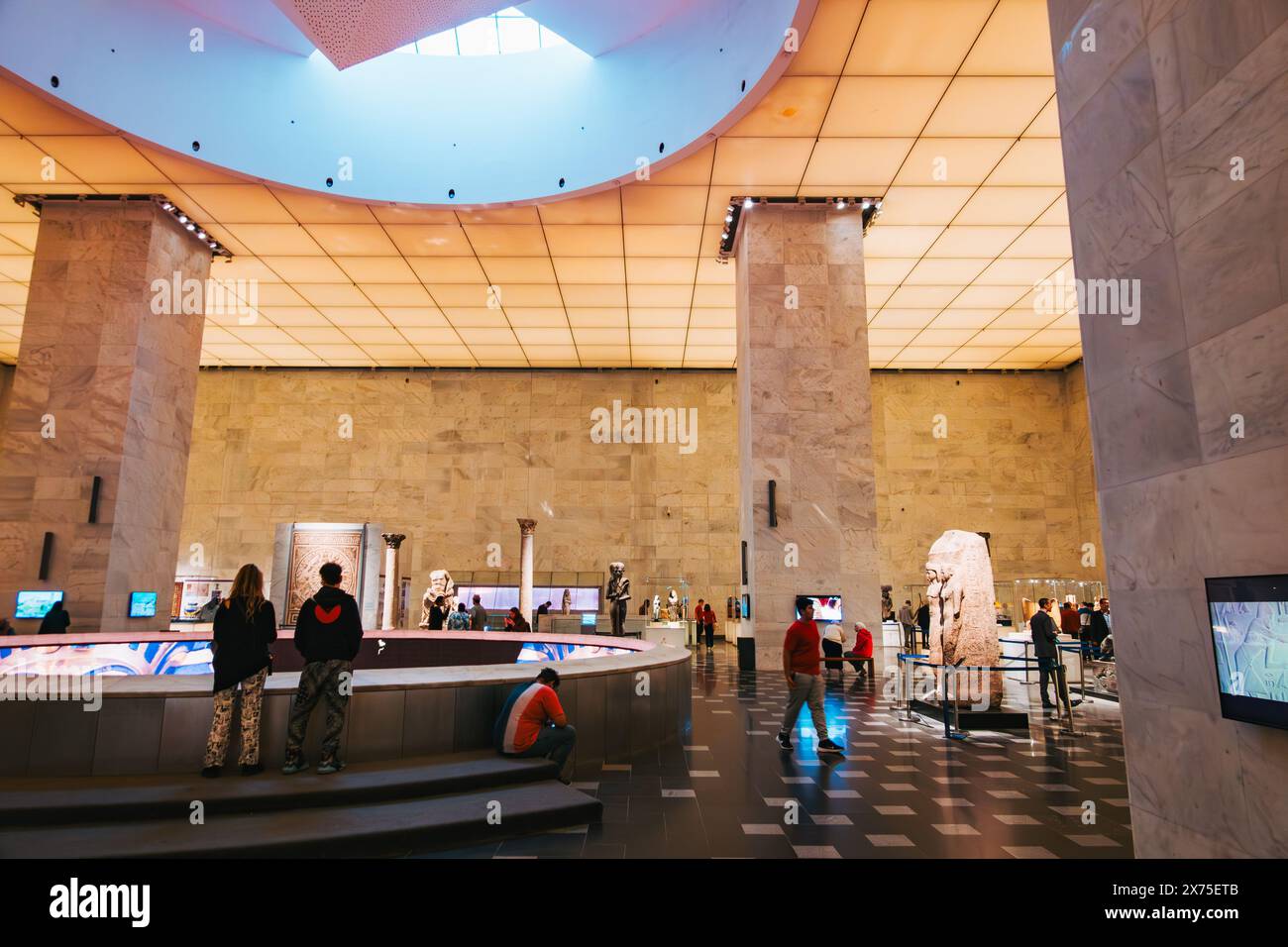 Inside the National Museum of Egyptian Civilization in Cairo, with statues, displays, and ...