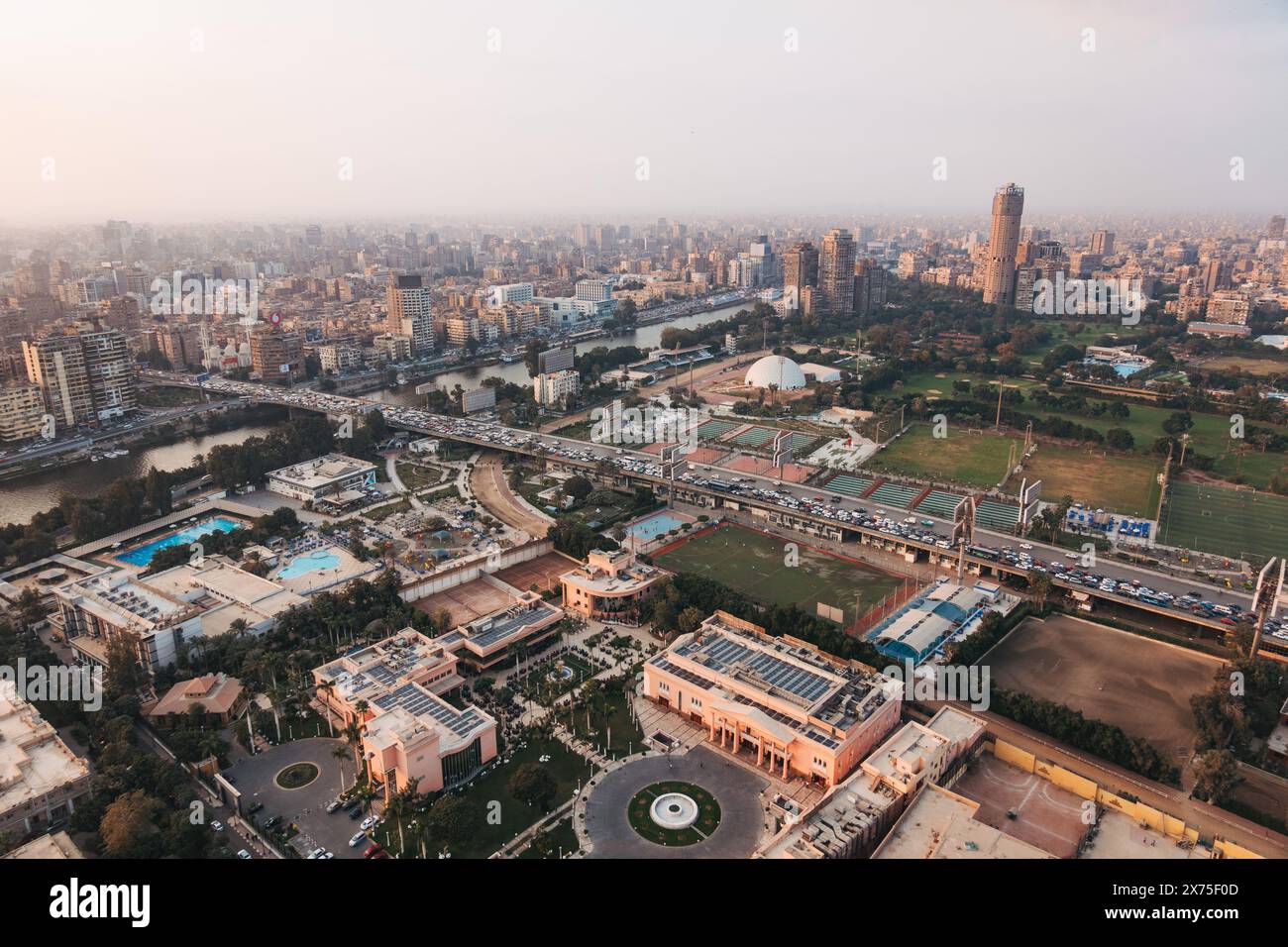 Aerial view of Cairo showing a bridge over the Nile, dense cityscape ...