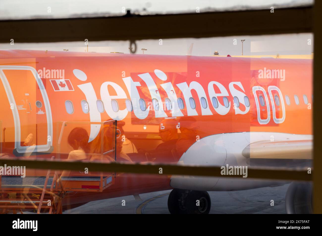 Miami, Florida, USA - 03 14 2024: The orange fuselage with white ...