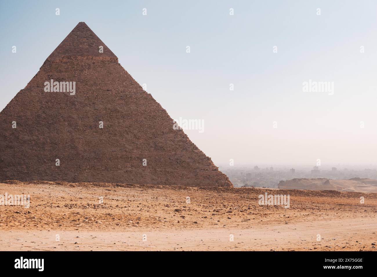 Side view of the Great Pyramid of Giza rising from the desert sands ...