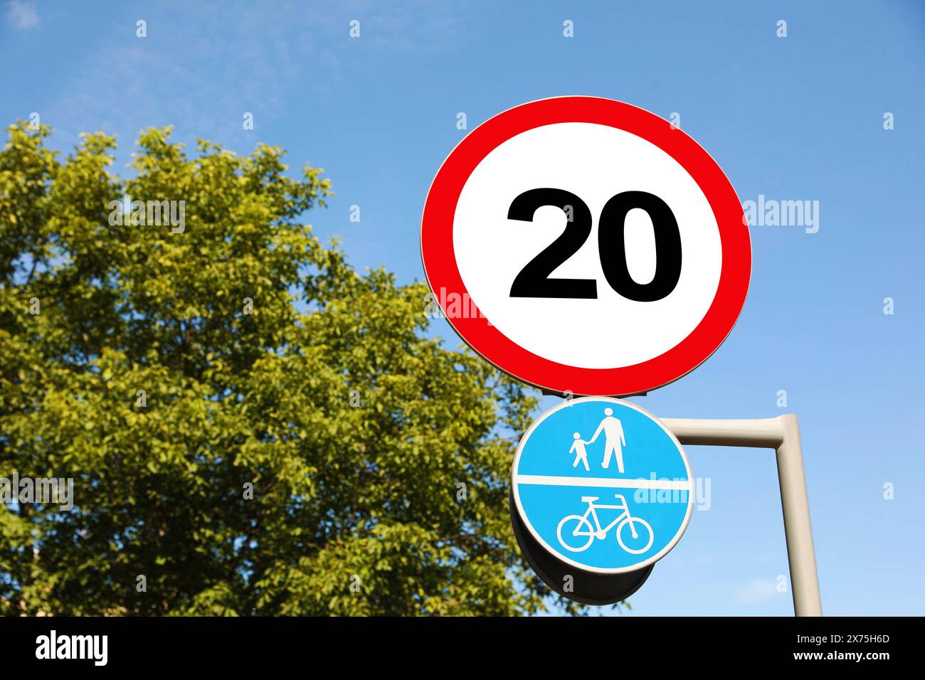 Road signs Maximum speed limit and Shared cycle and pedestrian path outdoors Stock Photo - Alamy