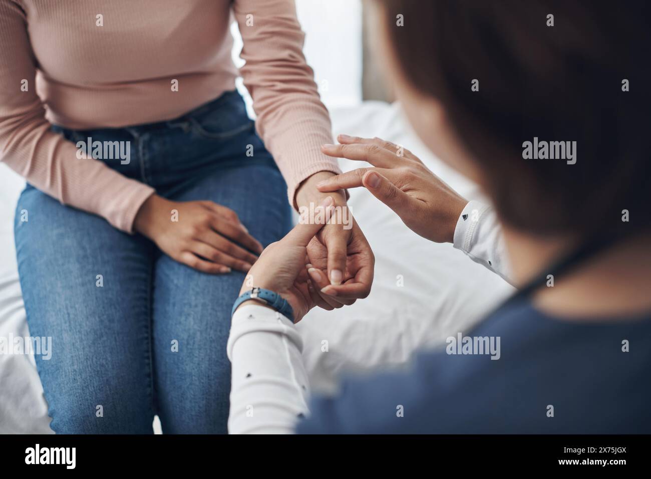 Doctor, hands and patient with checkup for pulse, wrist injury or ...