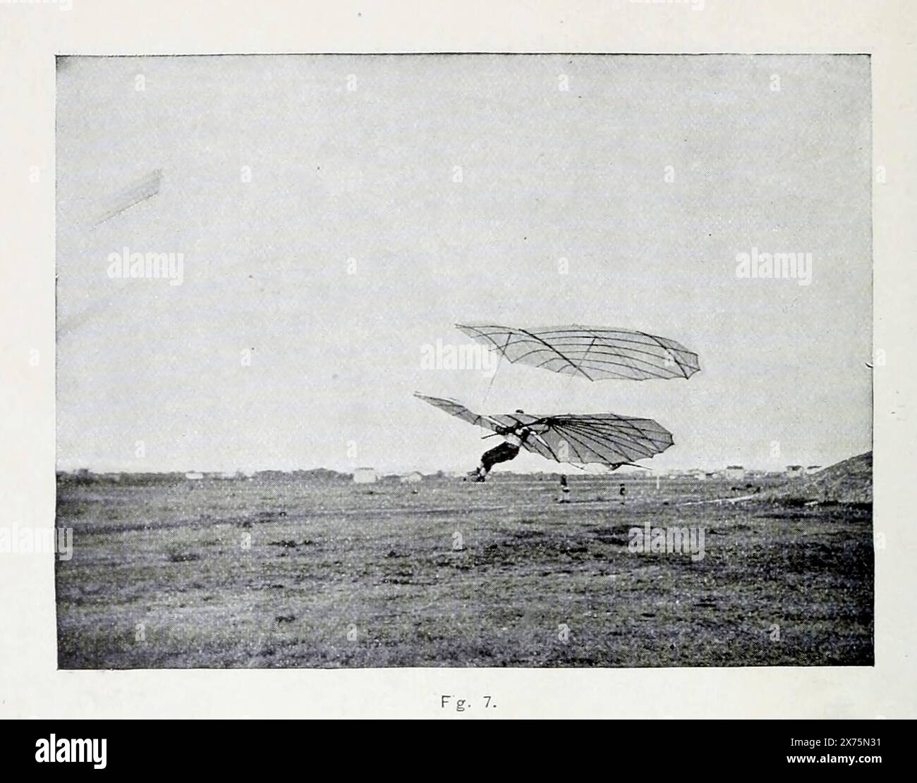 Early flying machine. The landing is brought about by raising the ...