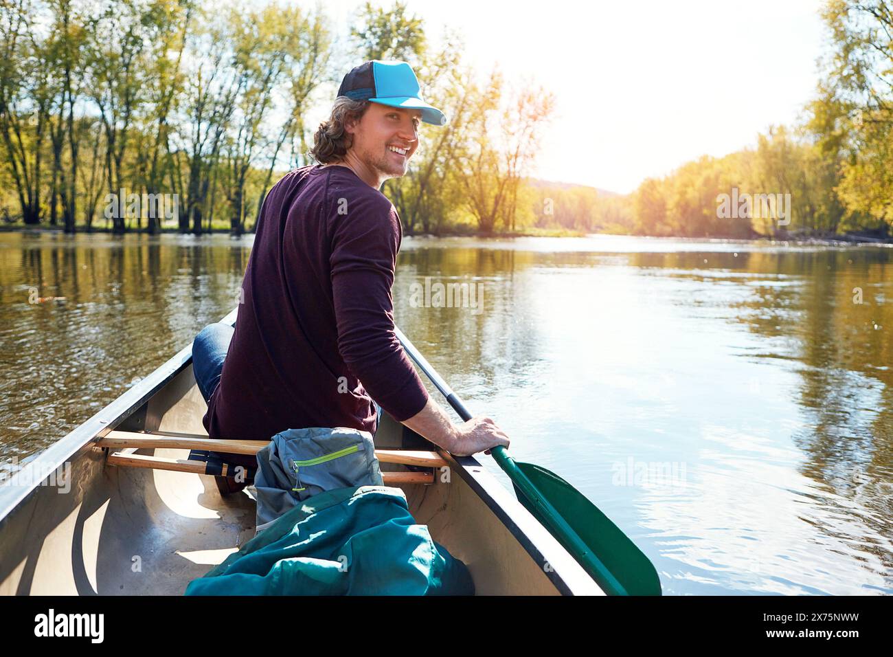 Back, relax and smile of man in kayak on lake for adventure, holiday or ...
