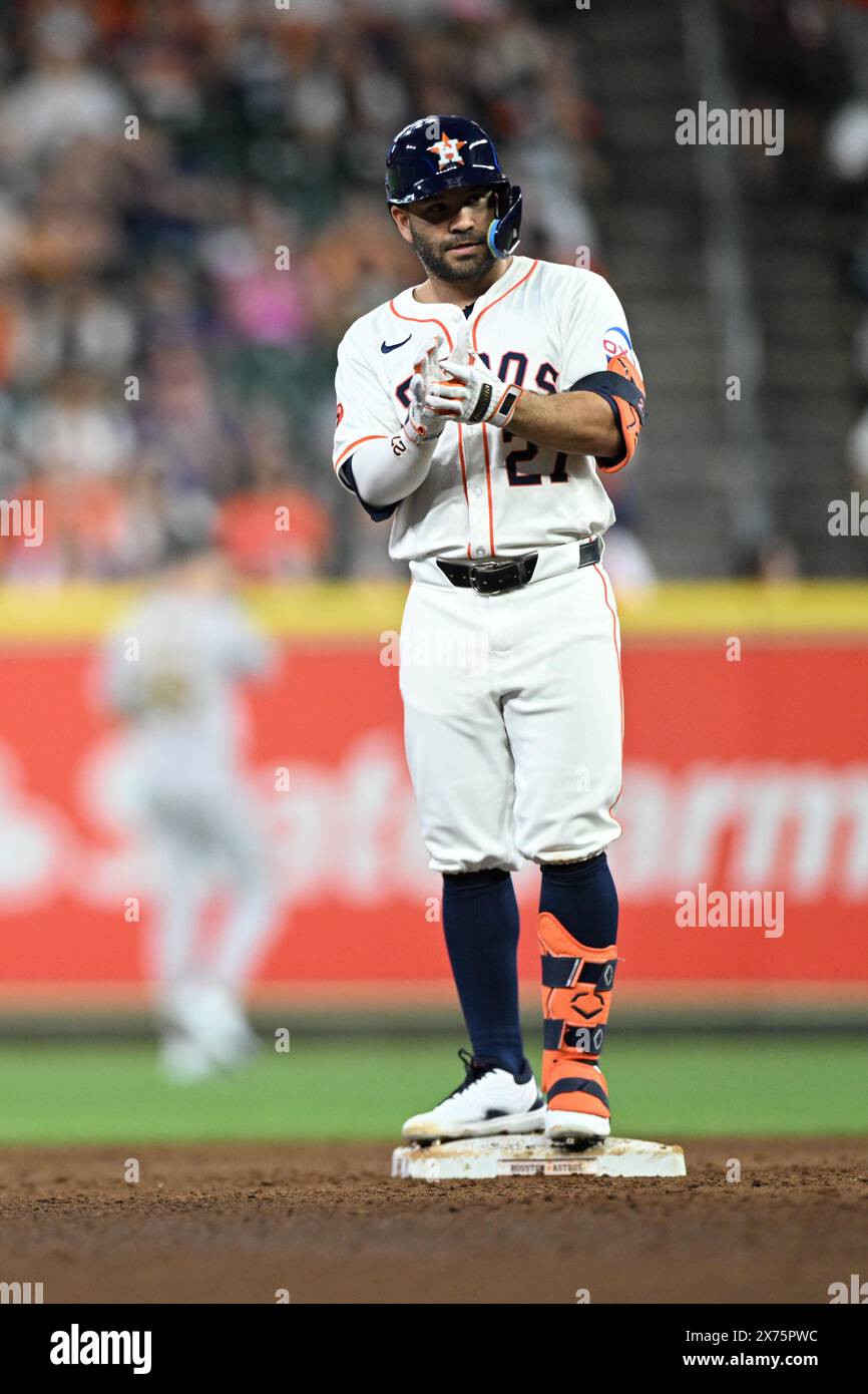 Houston Astros second base Jose Altuve (27) gets the 2100th hit of his career with a double in ...