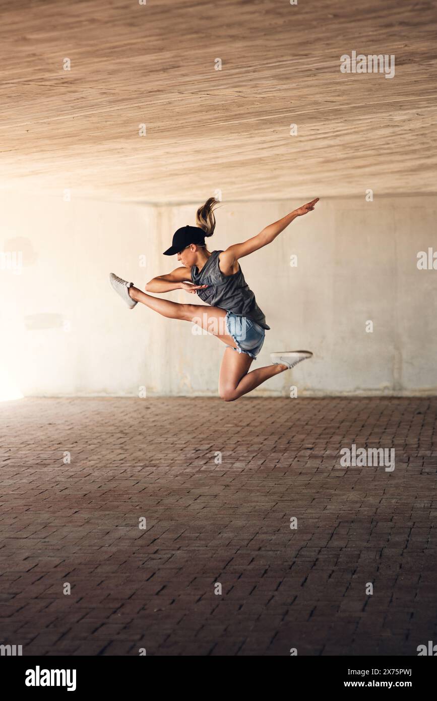 Woman, jump and dancing for hip hop in city with steps, freedom and ...