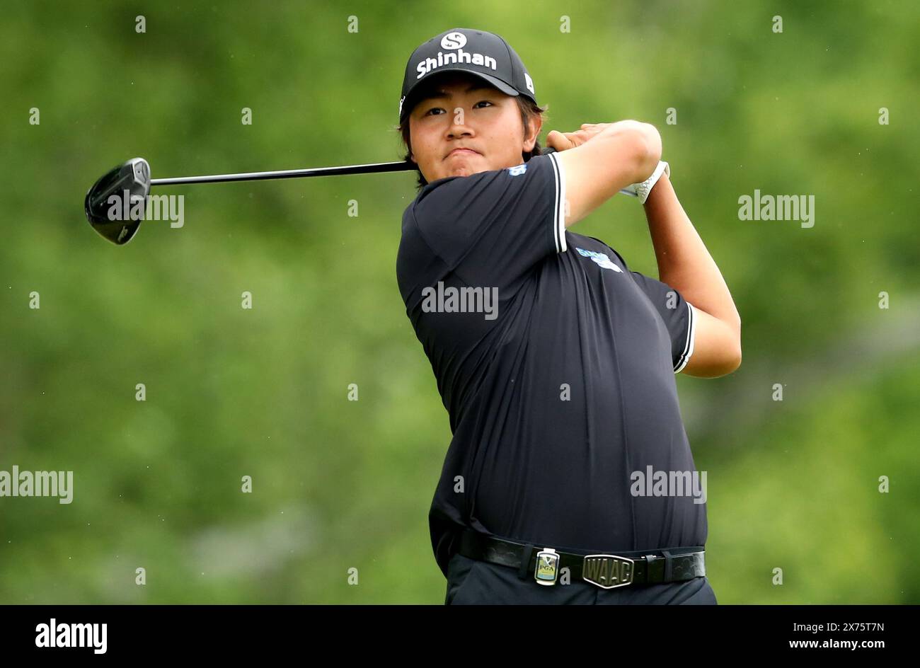 S.H. Kim from South Korea, tees off on the fifth tee during round two ...