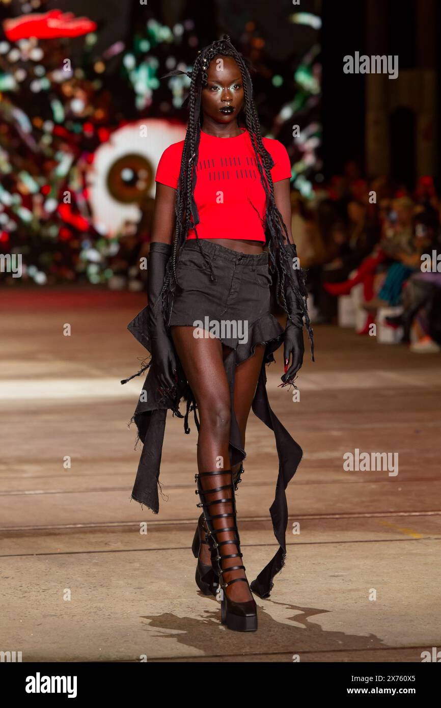 A model walks the runway during the INJURY show during Australian ...