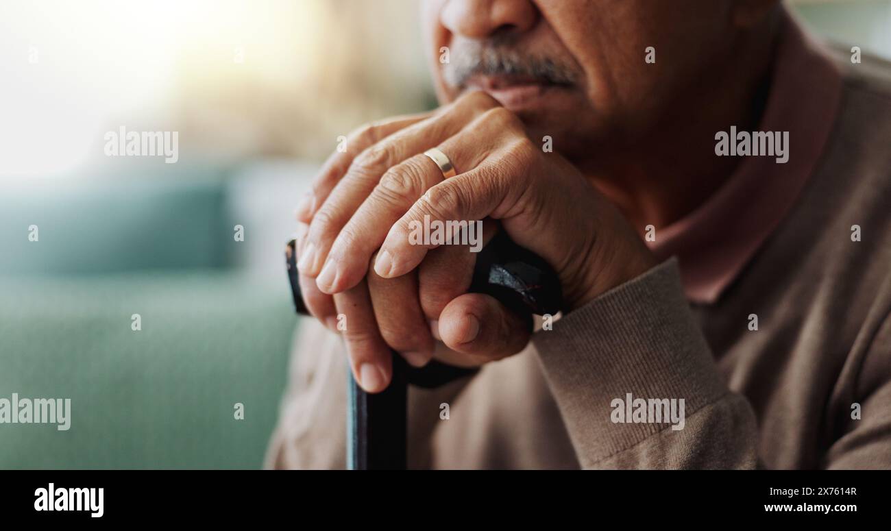 Old man, hands and walking stick in home for retirement grief for remember nostalgia, memory or ...