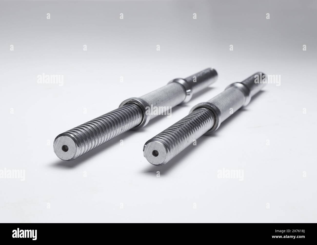 steel dumbbell rod with bolt isolated Stock Photo - Alamy