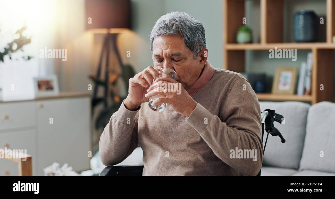Senior man, wheelchair and drinking water in home with depression, sick ...