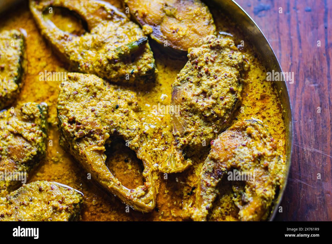Sorshe ilish or hilsa fish curry cooked with mustard seeds. It is a ...