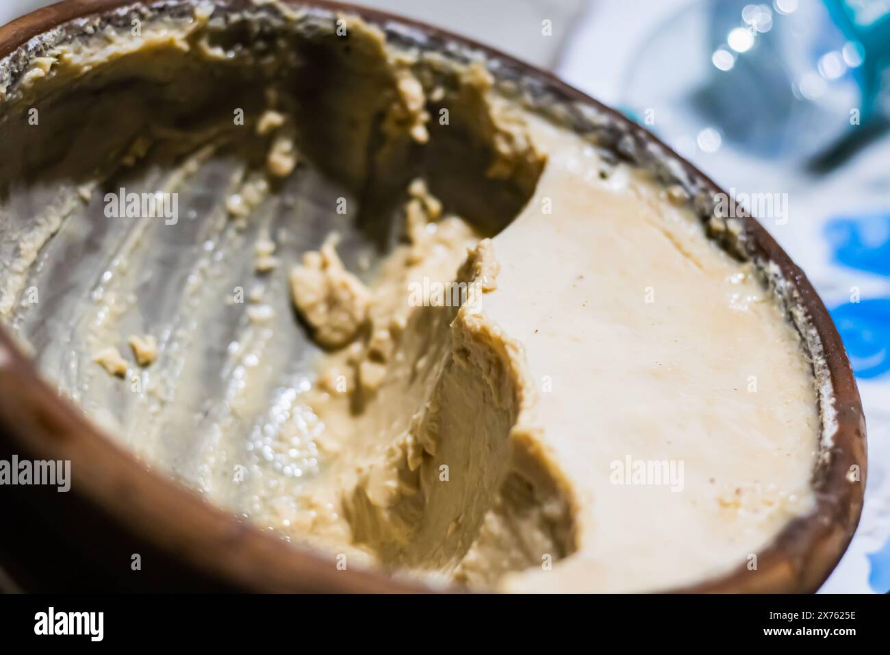 mishti doi or dahi or sweet yogurt being served earthen bowl. This ...