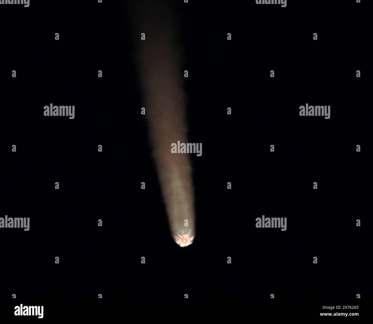 A SpaceX Falcon 9 rocket creates an exhaust plume as it launches 23 ...