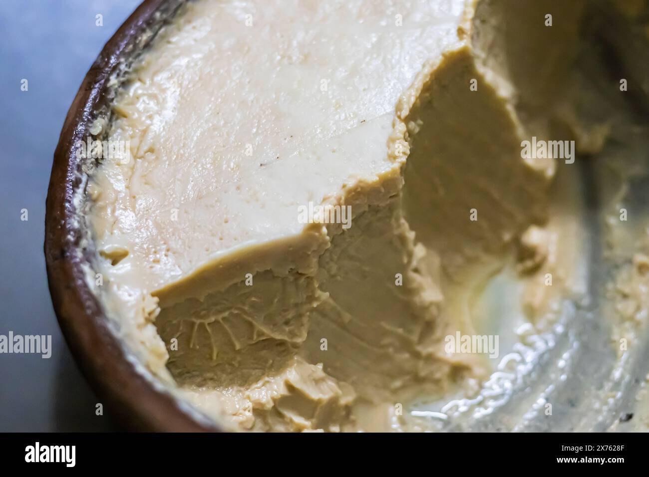 mishti doi or dahi or sweet yogurt being served earthen bowl. This ...