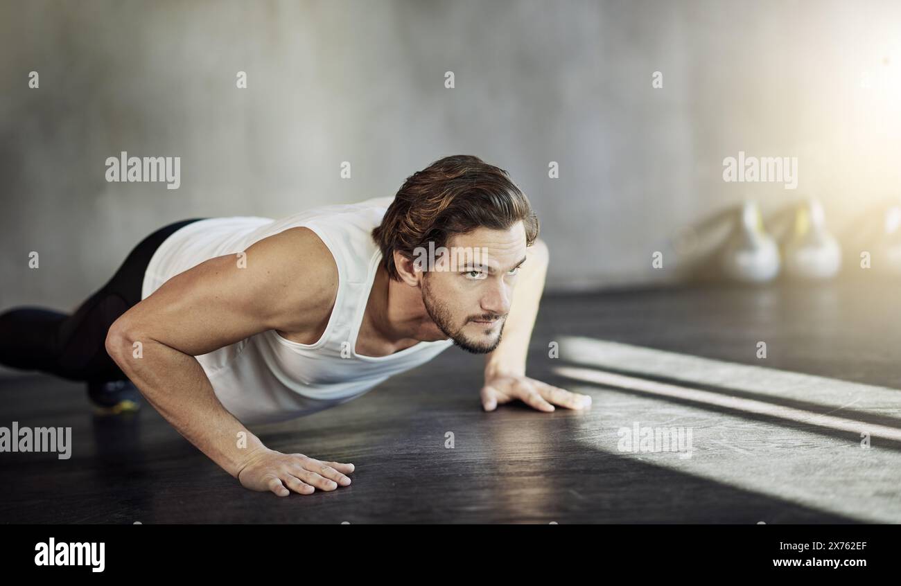 Man, push ups and strong exercise in gym, muscle gain and bodybuilder ...