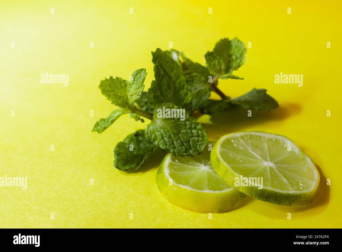 Lemon slices and min leaves kept together during summer season. These ...