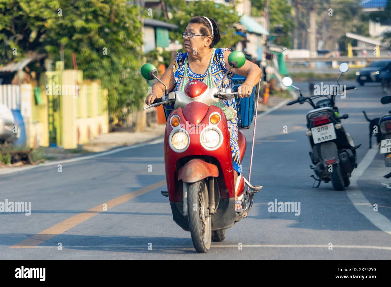 Old woman driving a motorcycle hi-res stock photography and images - Alamy