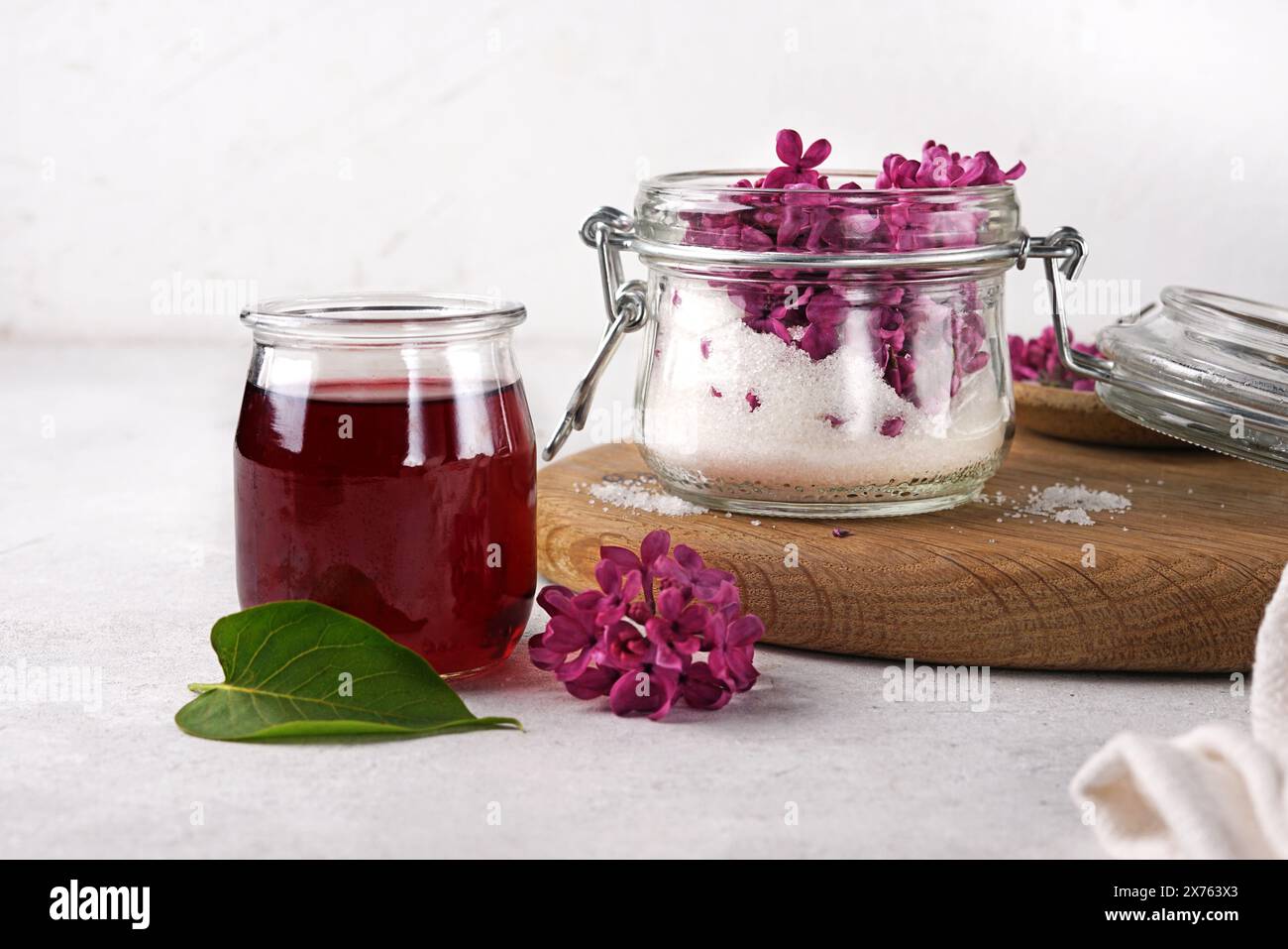 Preparation of syrup from the flowers of lilac. Glassware. White slate ...