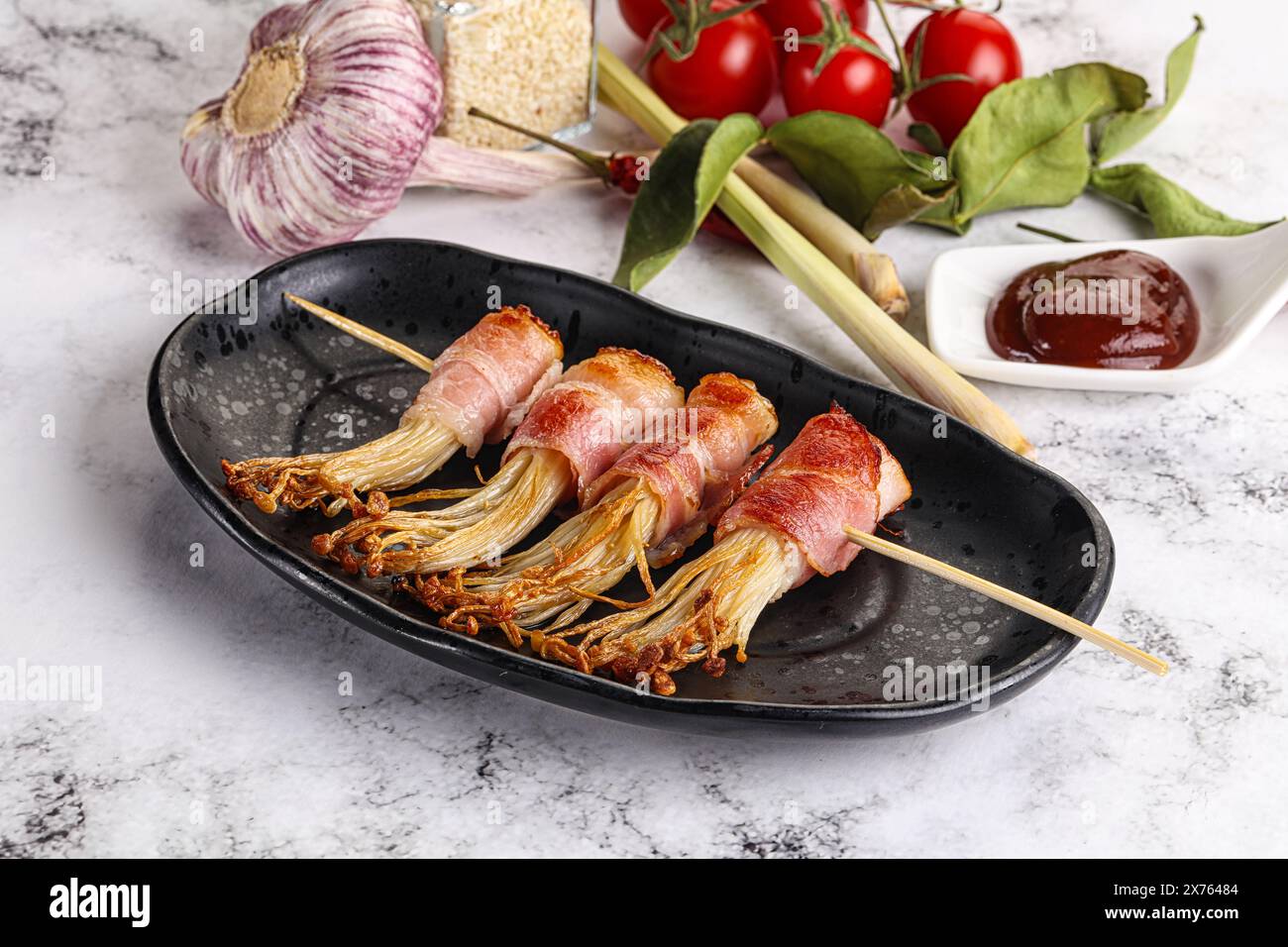 Tasty Grilled enoki mushroom with bacon Stock Photo - Alamy